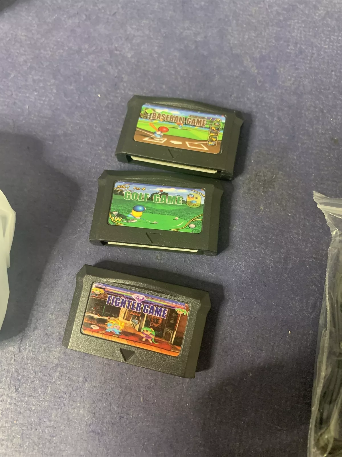 File:16-Bit Handheld Gaming Console - TaddToy cartridges.webp ...